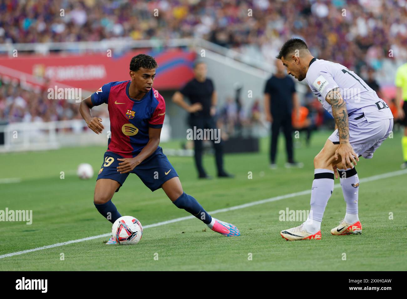 Barcelona's Lamine Yamal and Athletic Bilbao's Yuri Berchiche challenge ...