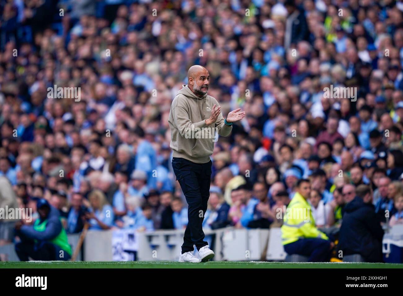 Manchester City's head coach Pep Guardiola reacts during the English ...
