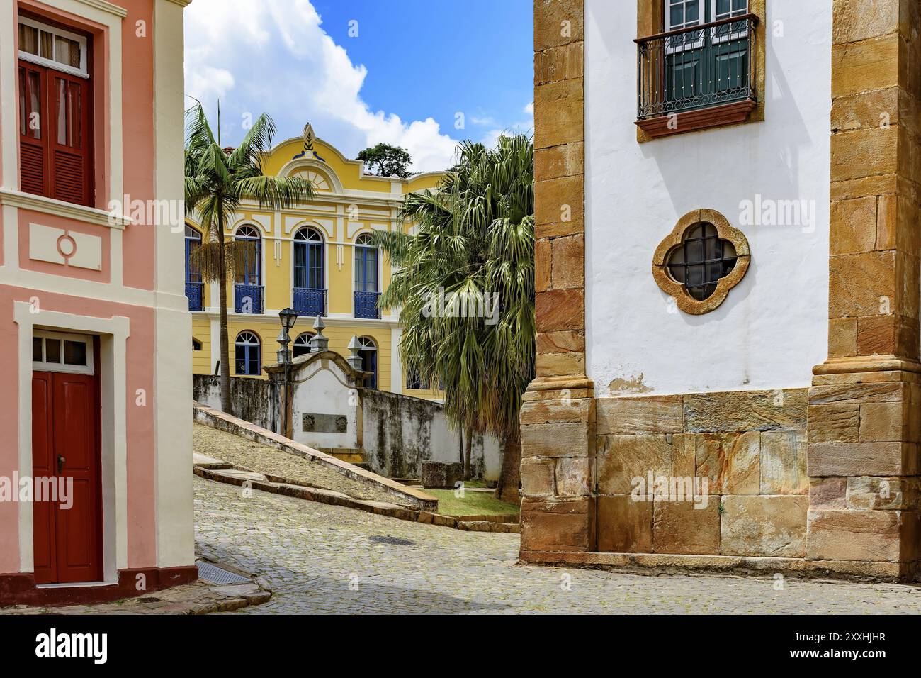 Old cobblestone street with houses in colonial architecture in the ...