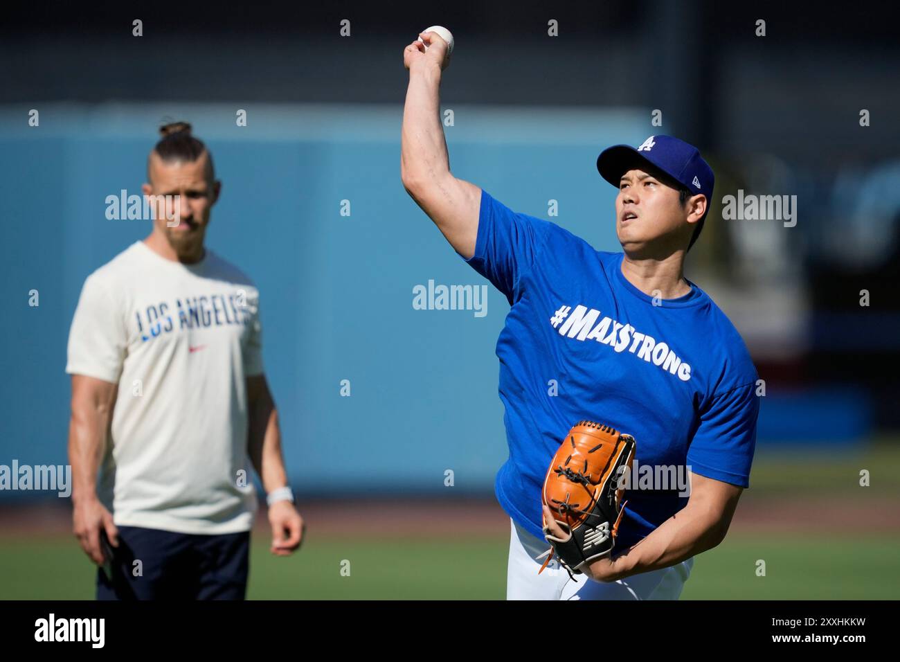Los Angeles Dodgers designated hitter Shohei Ohtani works out before a ...