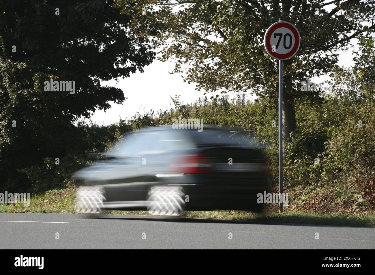 Speeding in front of a 70 km/h sign Stock Photo - Alamy