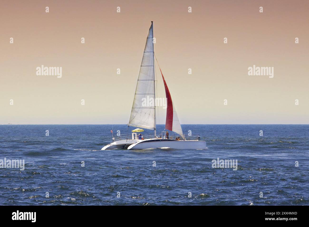 Sailing towards sunset Stock Photo - Alamy