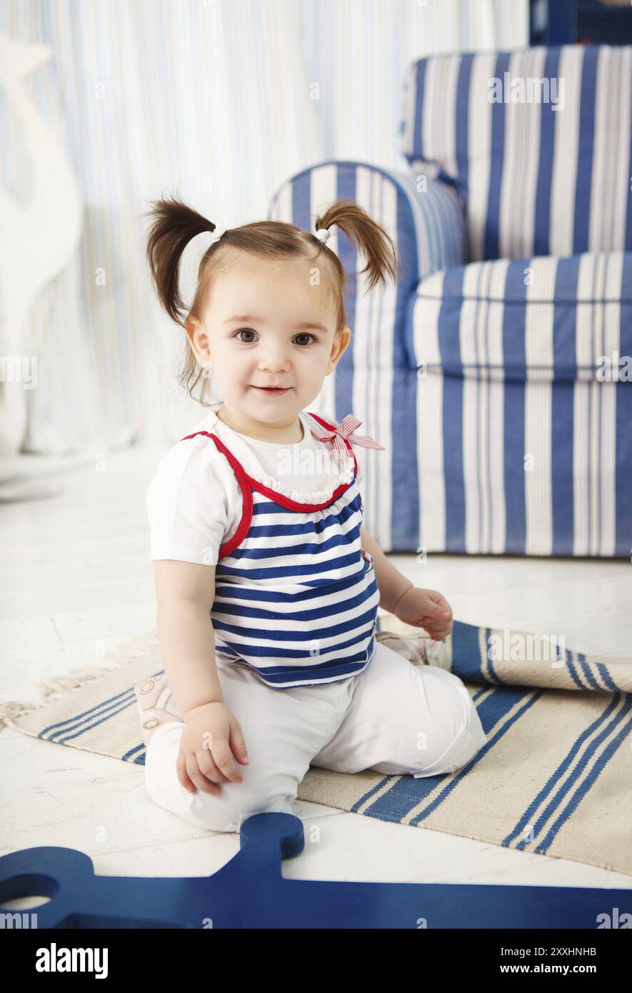 Portrait of the one year old baby girl indoor Stock Photo - Alamy