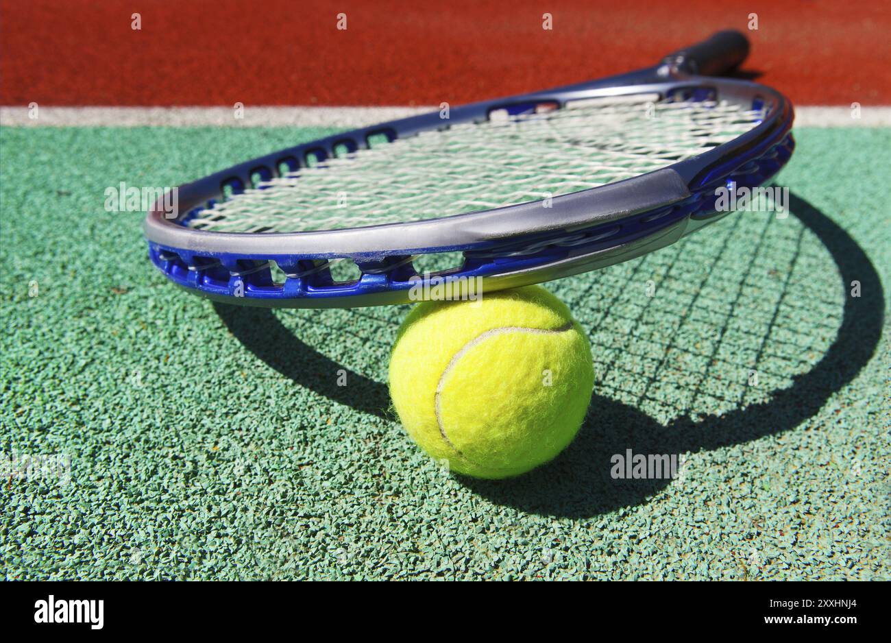 Close up of tennis racquet and ball on the clay tennis court Stock ...