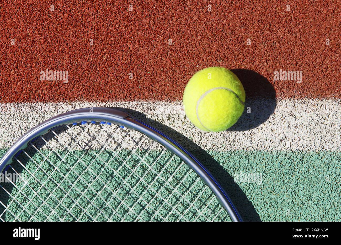 Close up of tennis racquet and ball on the clay tennis court Stock ...