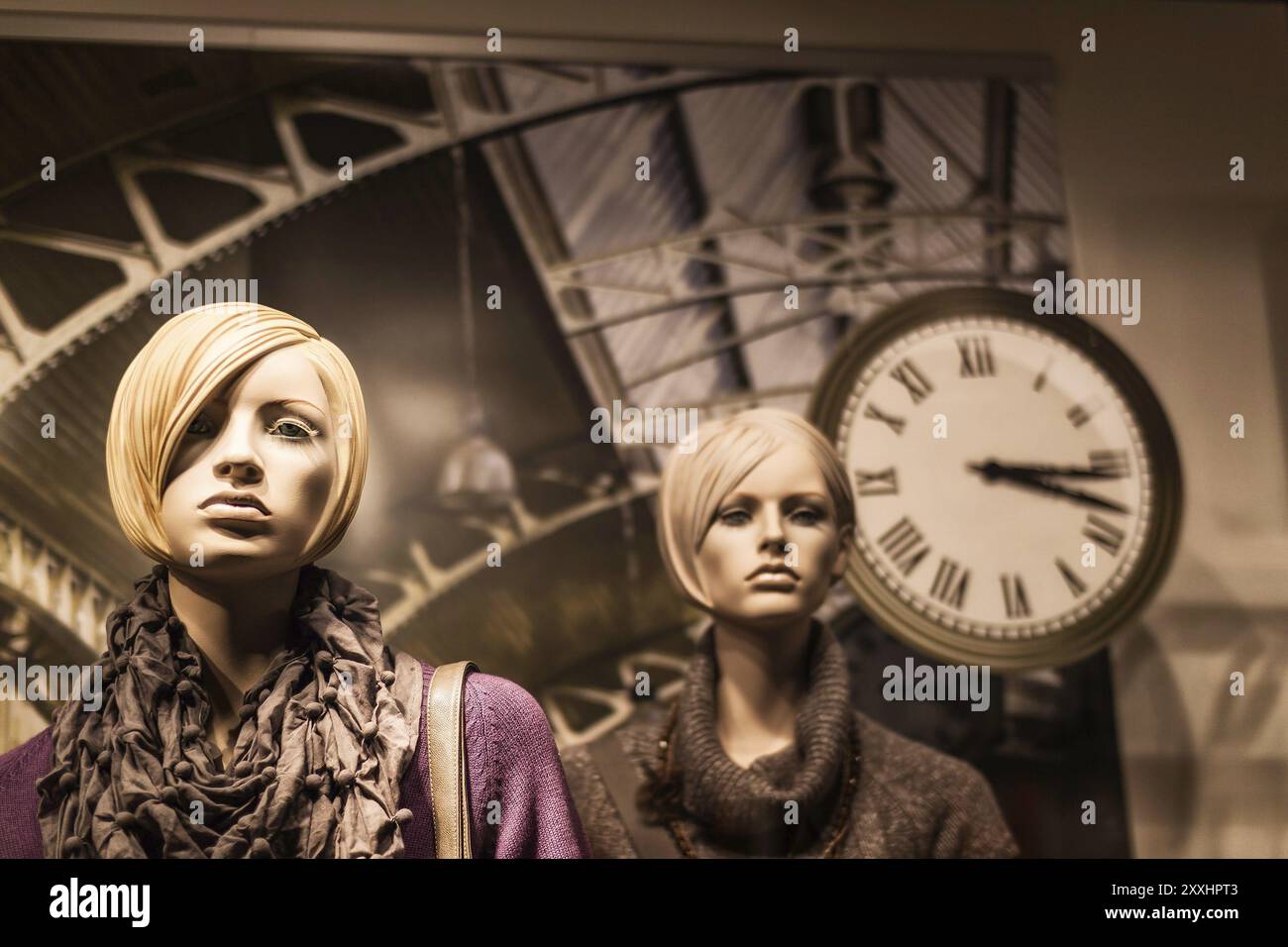 Two mannequins and a clock Stock Photo - Alamy