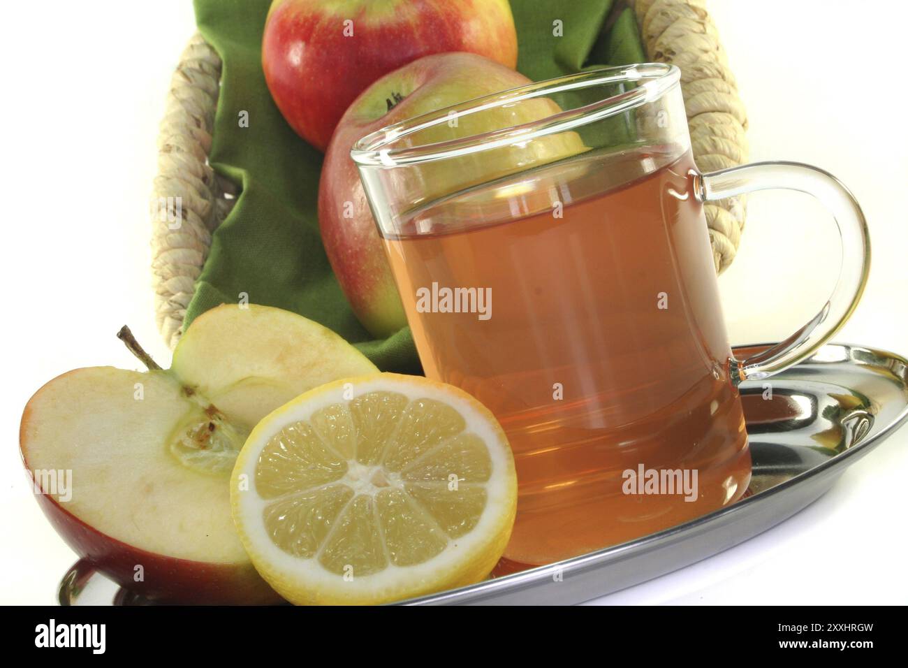 A glass of apple-lemon tea with fresh apples and lemon Stock Photo - Alamy