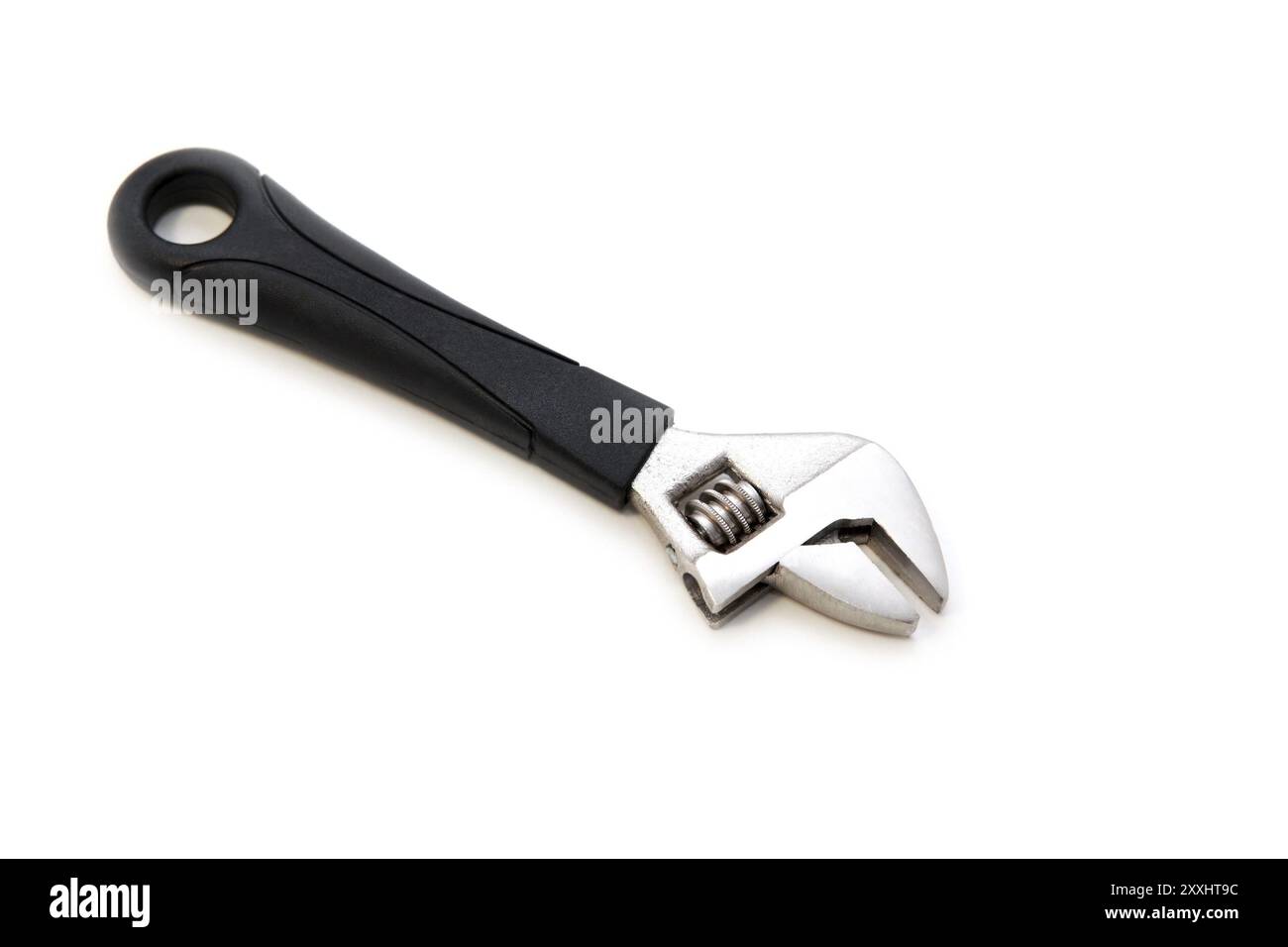 Universal metal wrench on white background Stock Photo - Alamy