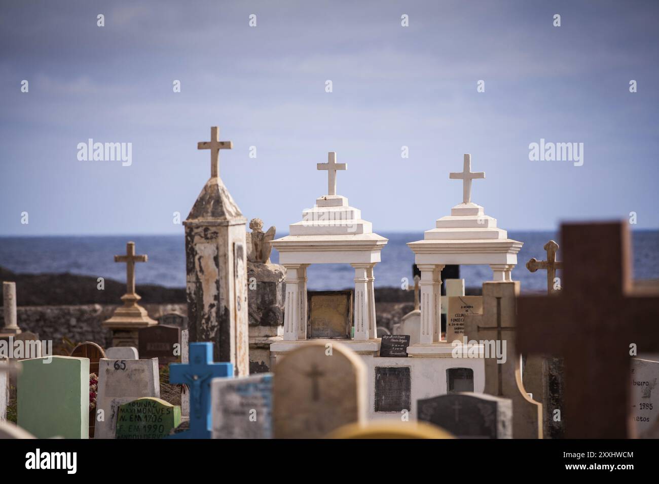 Three graves with crosses at the top of a large cemetery Stock Photo ...