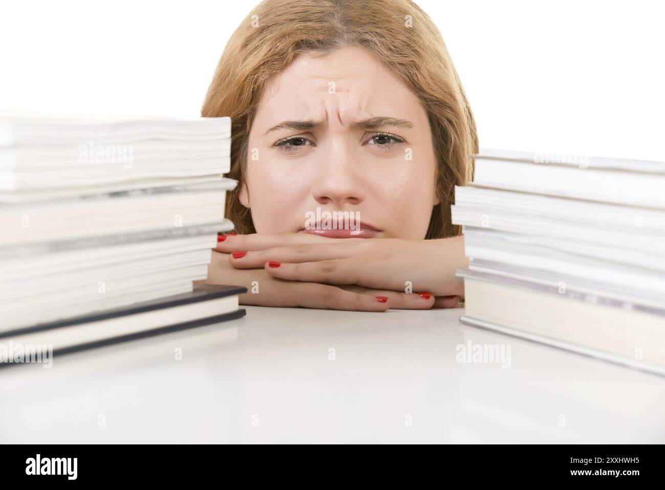 Young woman tired of studying hard for her exams Stock Photo - Alamy