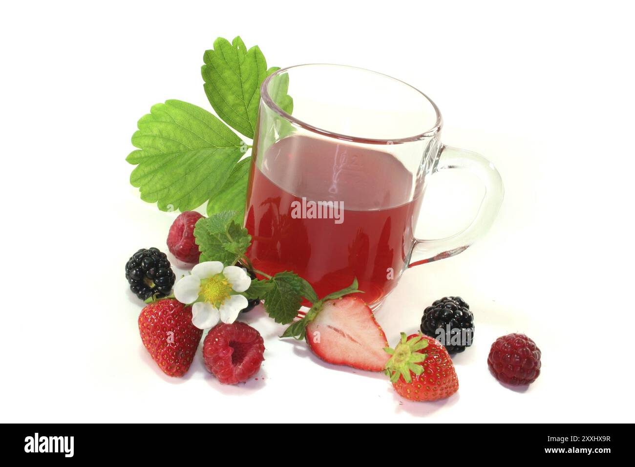 A glass of forest fruit tea with fresh fruit Stock Photo - Alamy