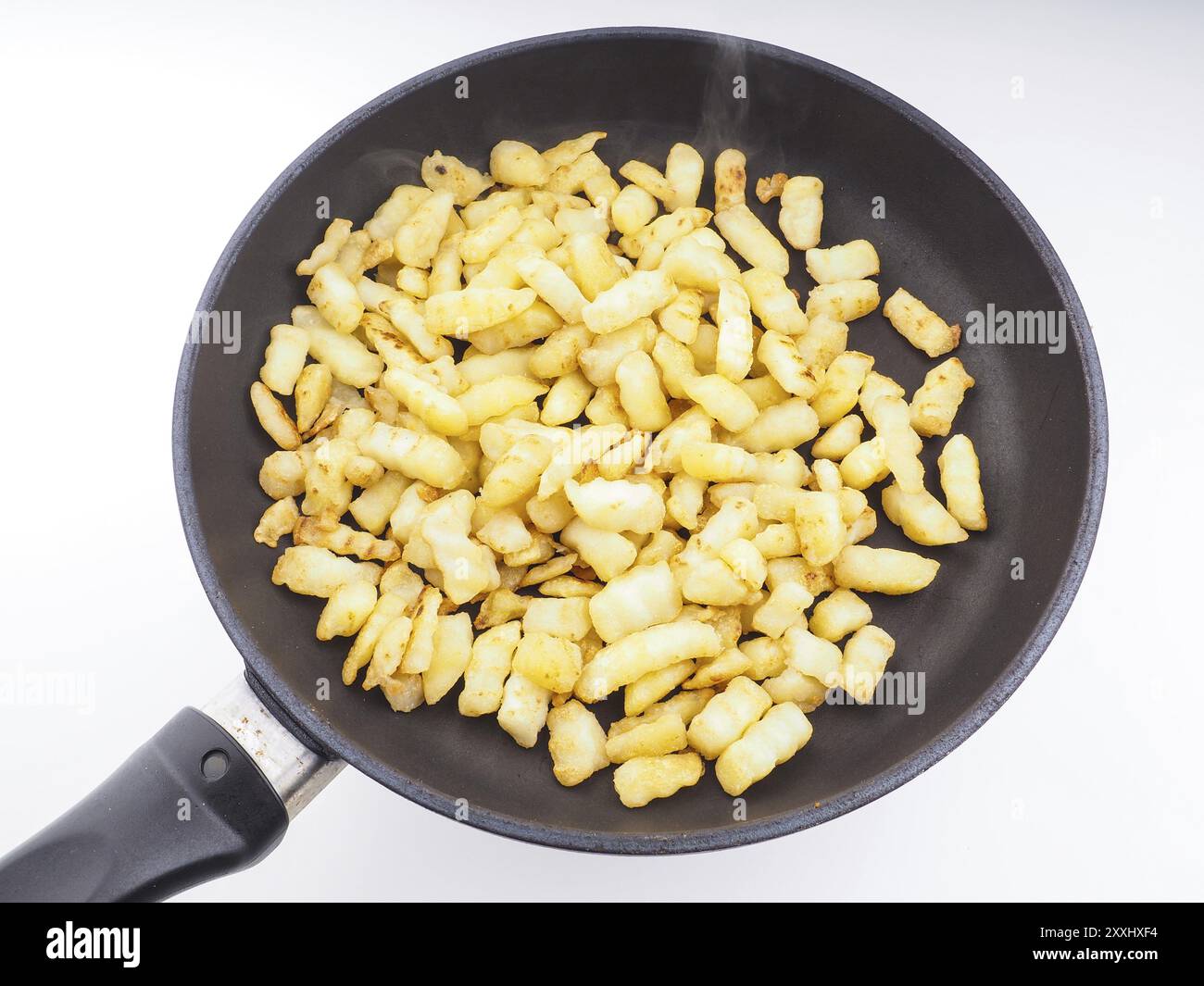 Chopped potatoes frying in pan hi-res stock photography and images - Alamy