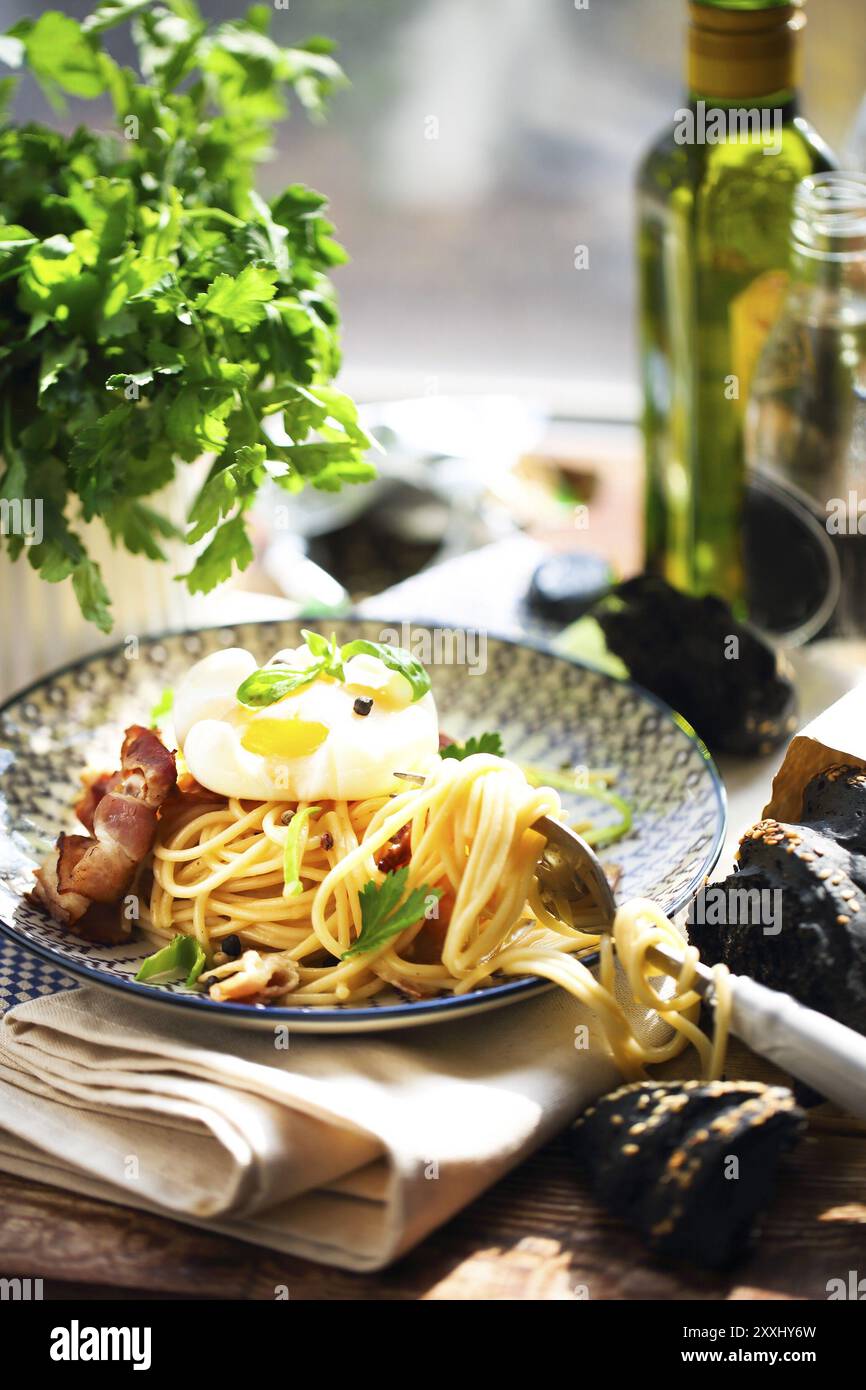 Nicely served spaghetti carbonaraby the window with arty garnish Stock ...