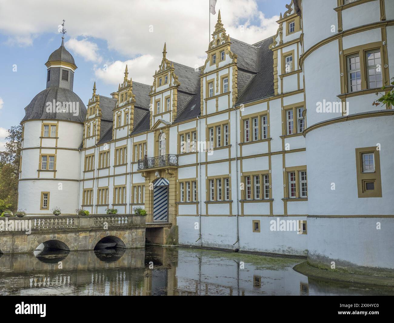 Historic Renaissance castle with majestic towers, windows and a moat ...
