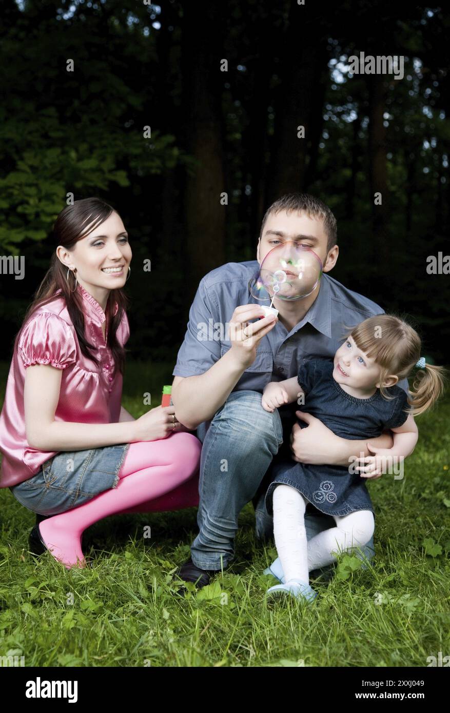 Father Blowing Soap Bubbles. Family Portrait Stock Photo - Alamy
