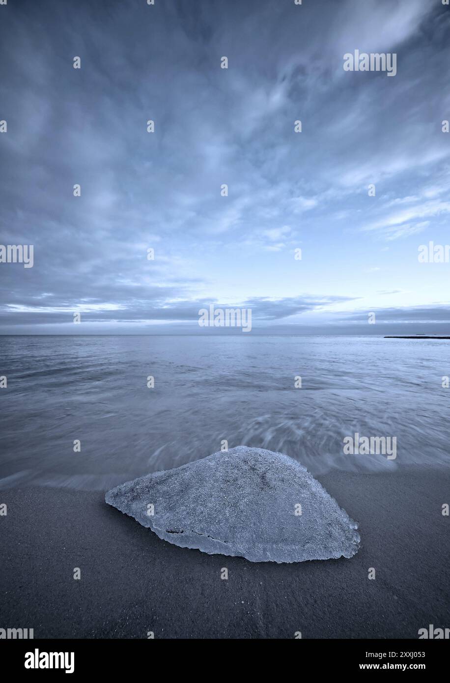 Night seascape with ice on the beach Stock Photo - Alamy
