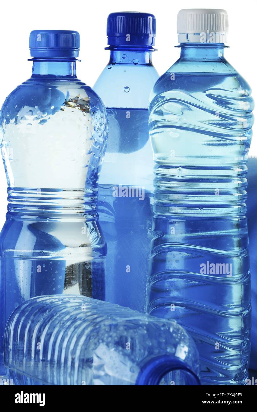 Polycarbonate plastic bottles of mineral water on white background ...