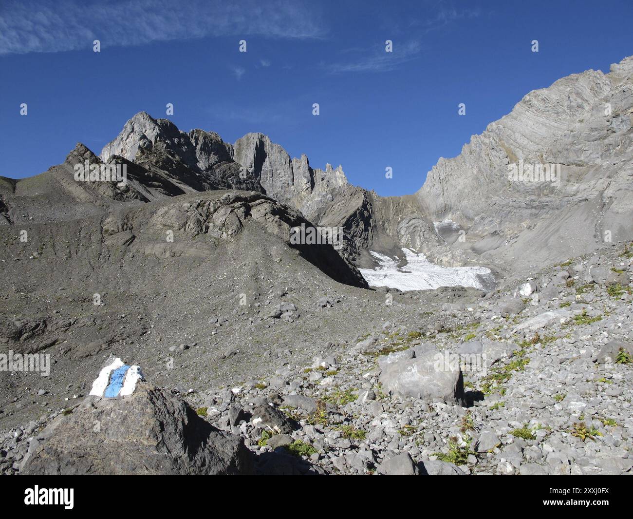 Blue-white sign, signs mountain-path. Mountain-pass named Zeinenfurggel ... Blue-white sign, signs mountain-path. Mountain-pass named Zeinenfurggel ...