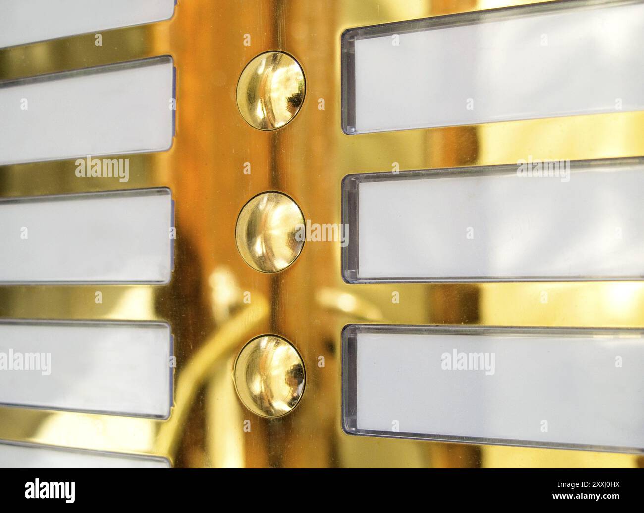 Golden door bell name plate and the facade Stock Photo - Alamy