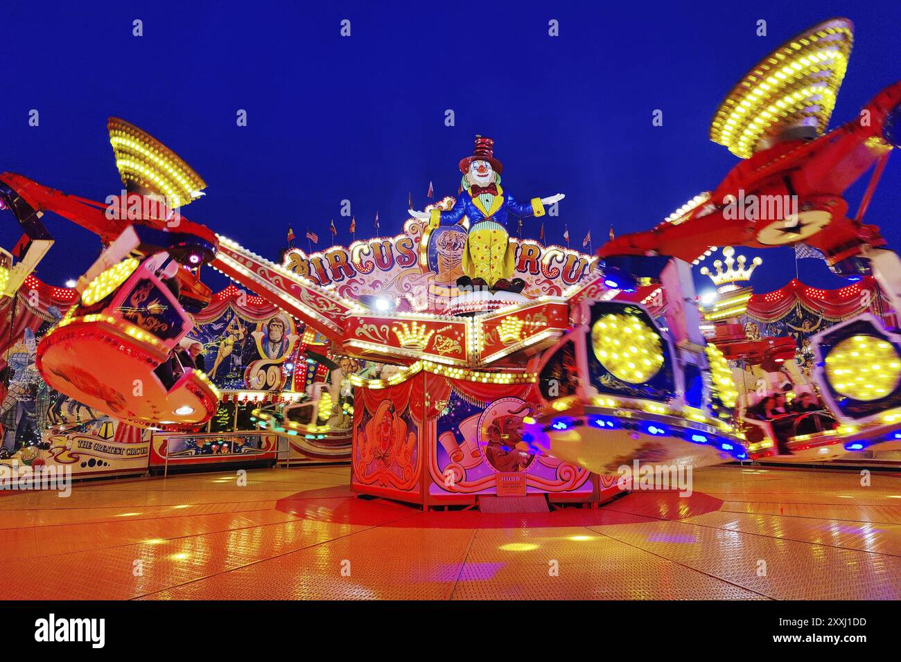 The illuminated carousel Circus Circus in the evening, Cranger Kirmes ...