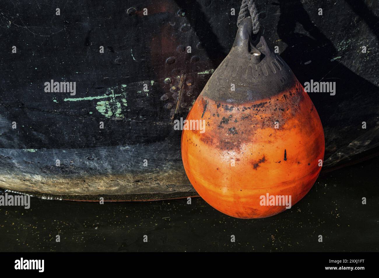 Fender on a boat in the harbour Stock Photo - Alamy