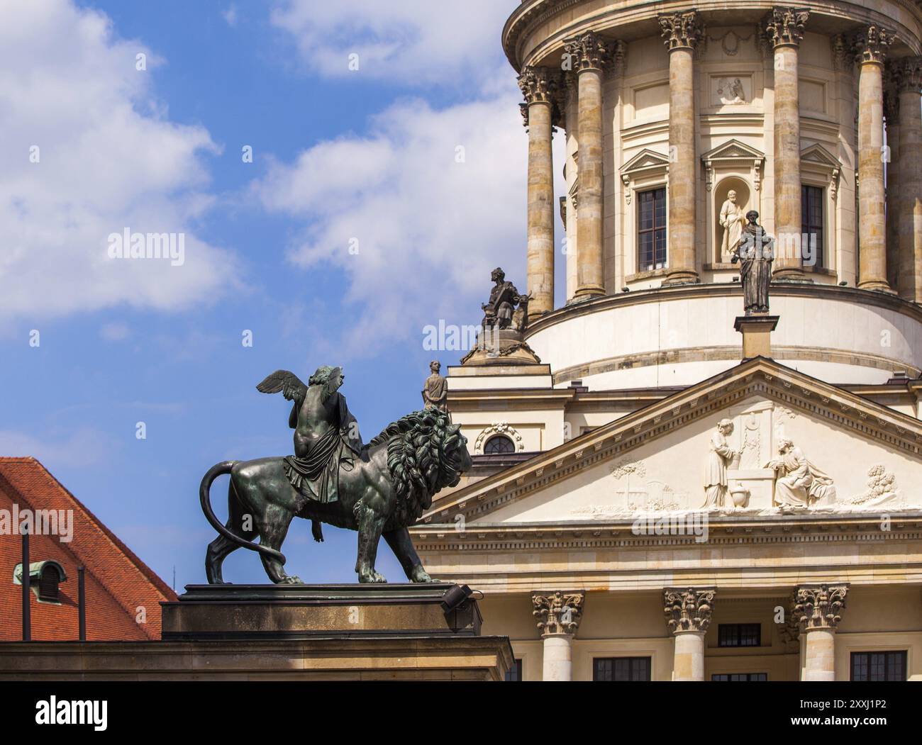 Statue of an angel riding a lion and playing the harp, with the French ...