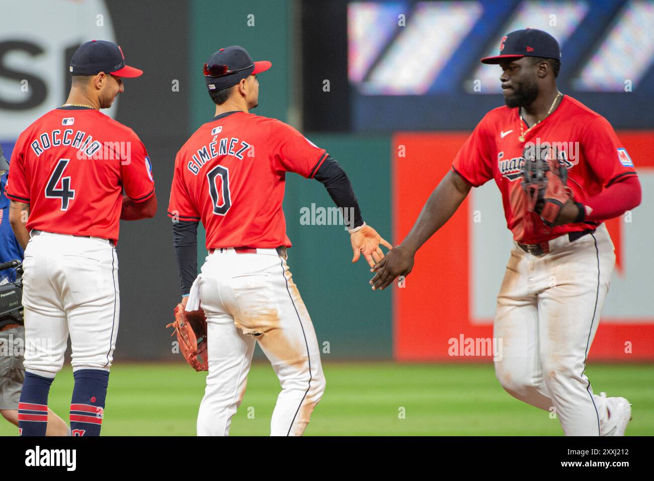 Cleveland Guardians' Andres Gimenez (0) greets Jhonkensy Noel, right ...