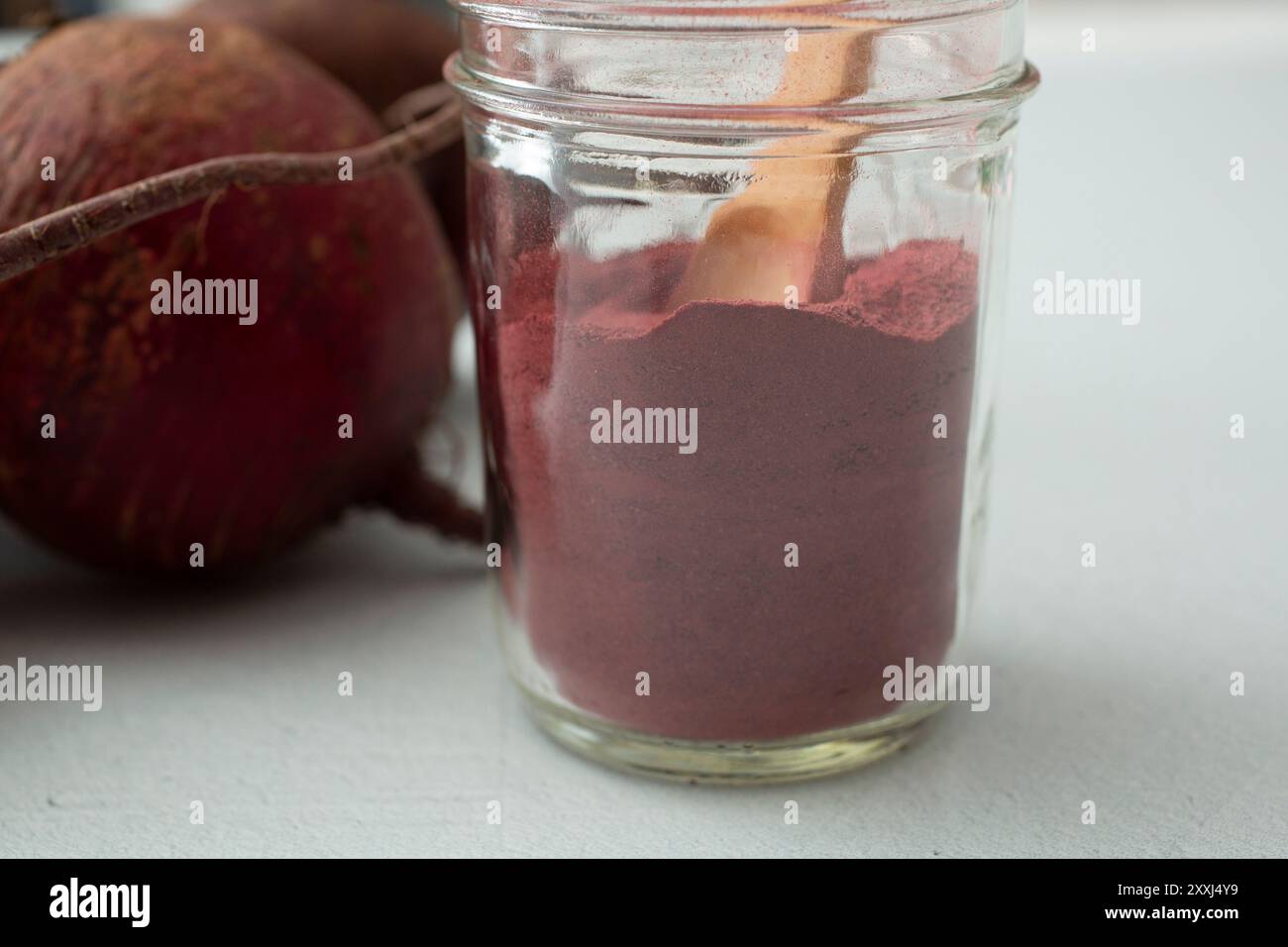 A view of a mason jar of beet powder Stock Photo - Alamy