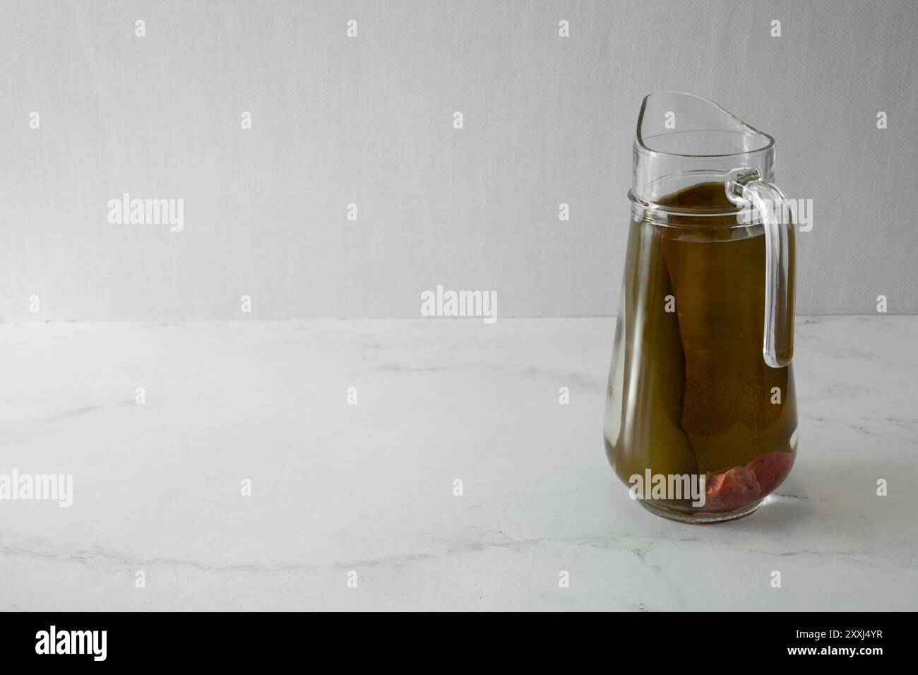 A view of a glass pitcher of kombu water, on the right side of the ...