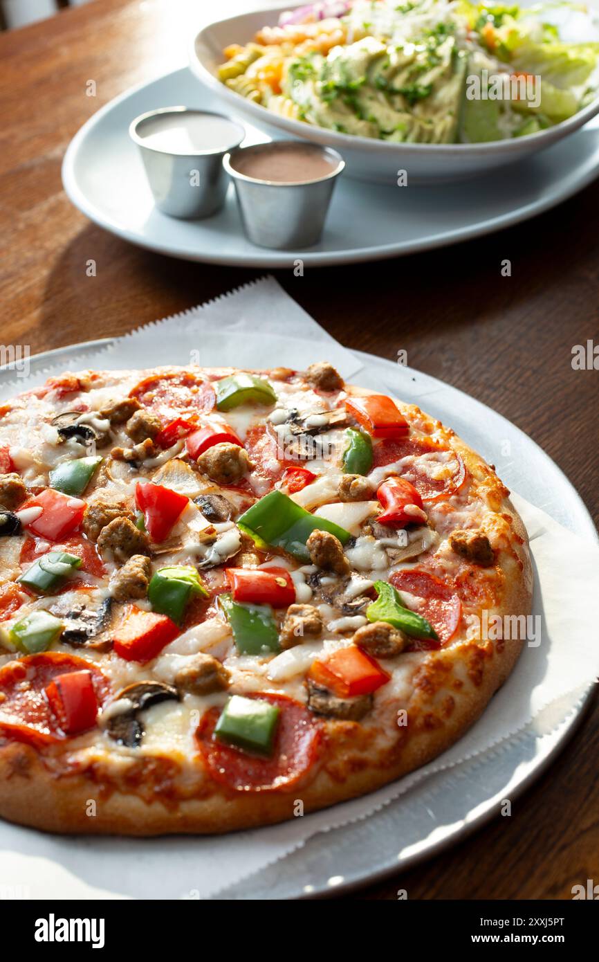 A view of a deluxe personal pizza Stock Photo - Alamy