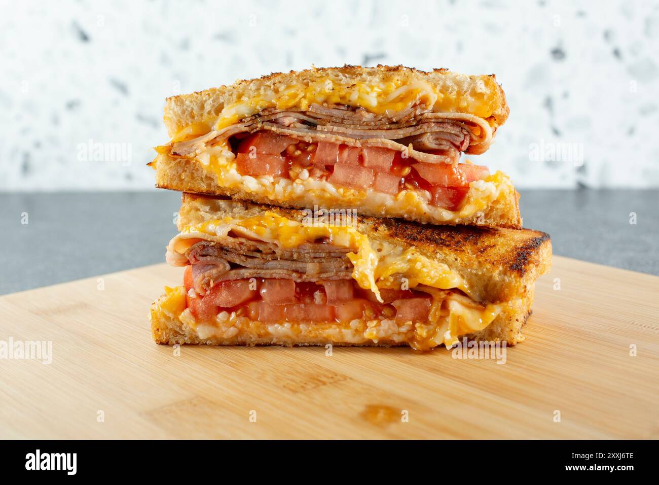 A view of a stacked ham and turkey melt Stock Photo - Alamy