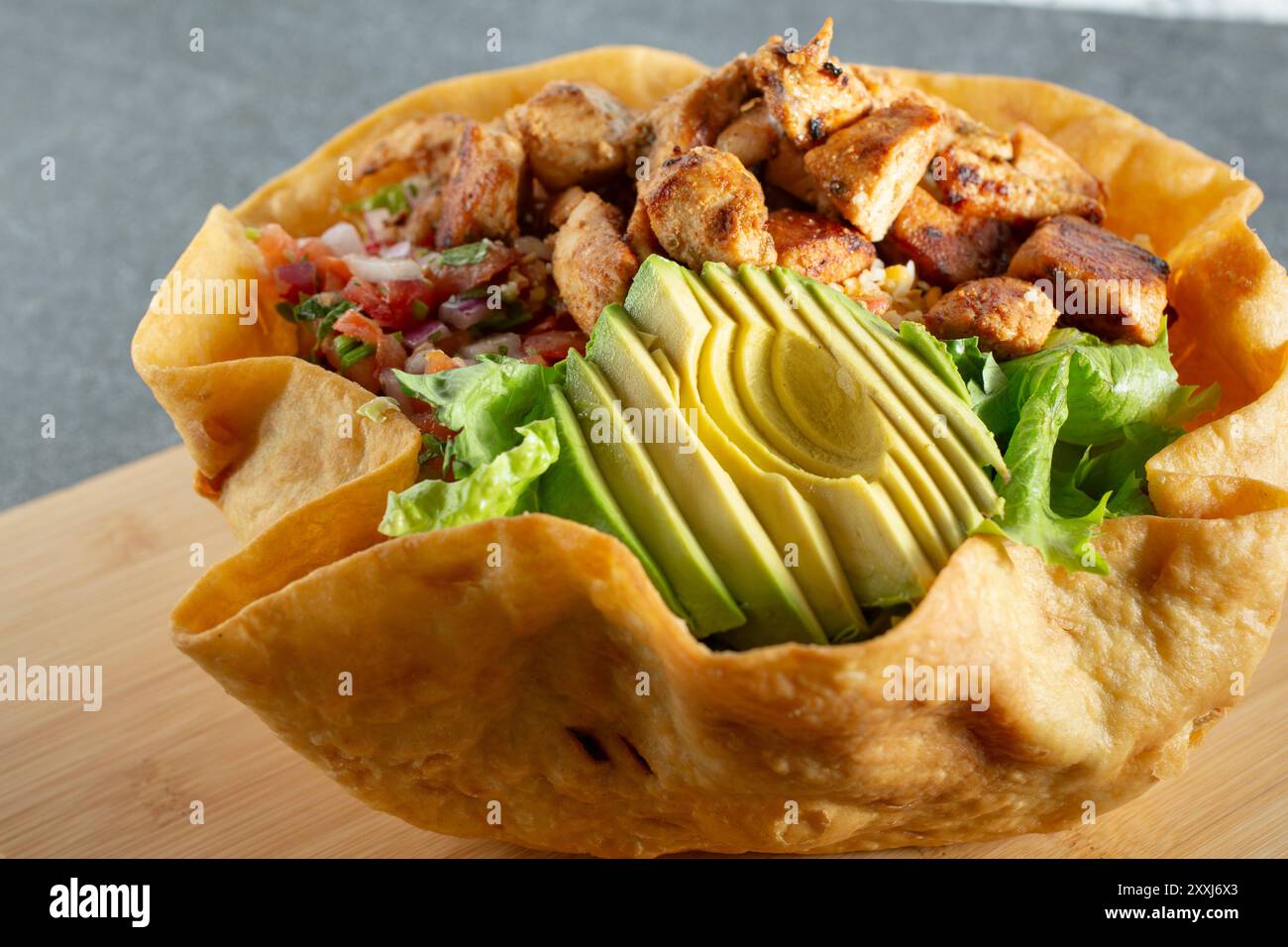 A view of a taco salad in a deep fried shell Stock Photo - Alamy