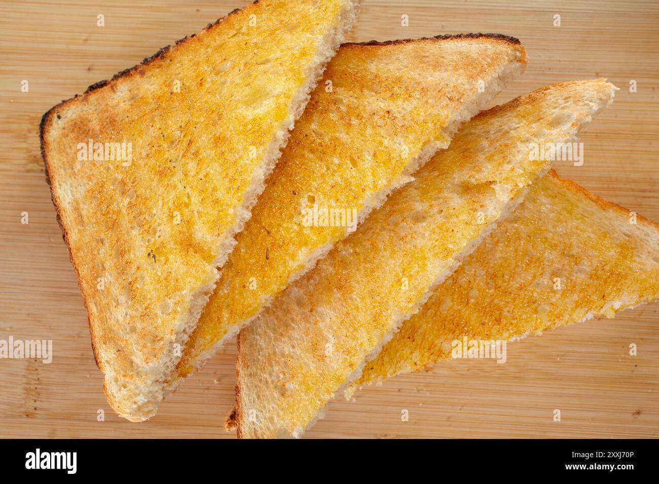 A top down view of slices of buttered toast Stock Photo - Alamy