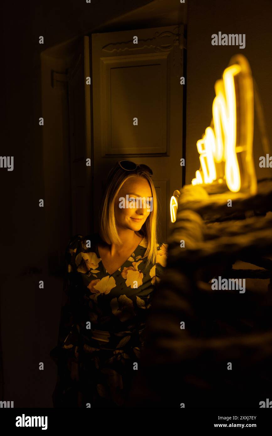 beautiful girl in the warm glow of an incandescent lamp Stock Photo - Alamy