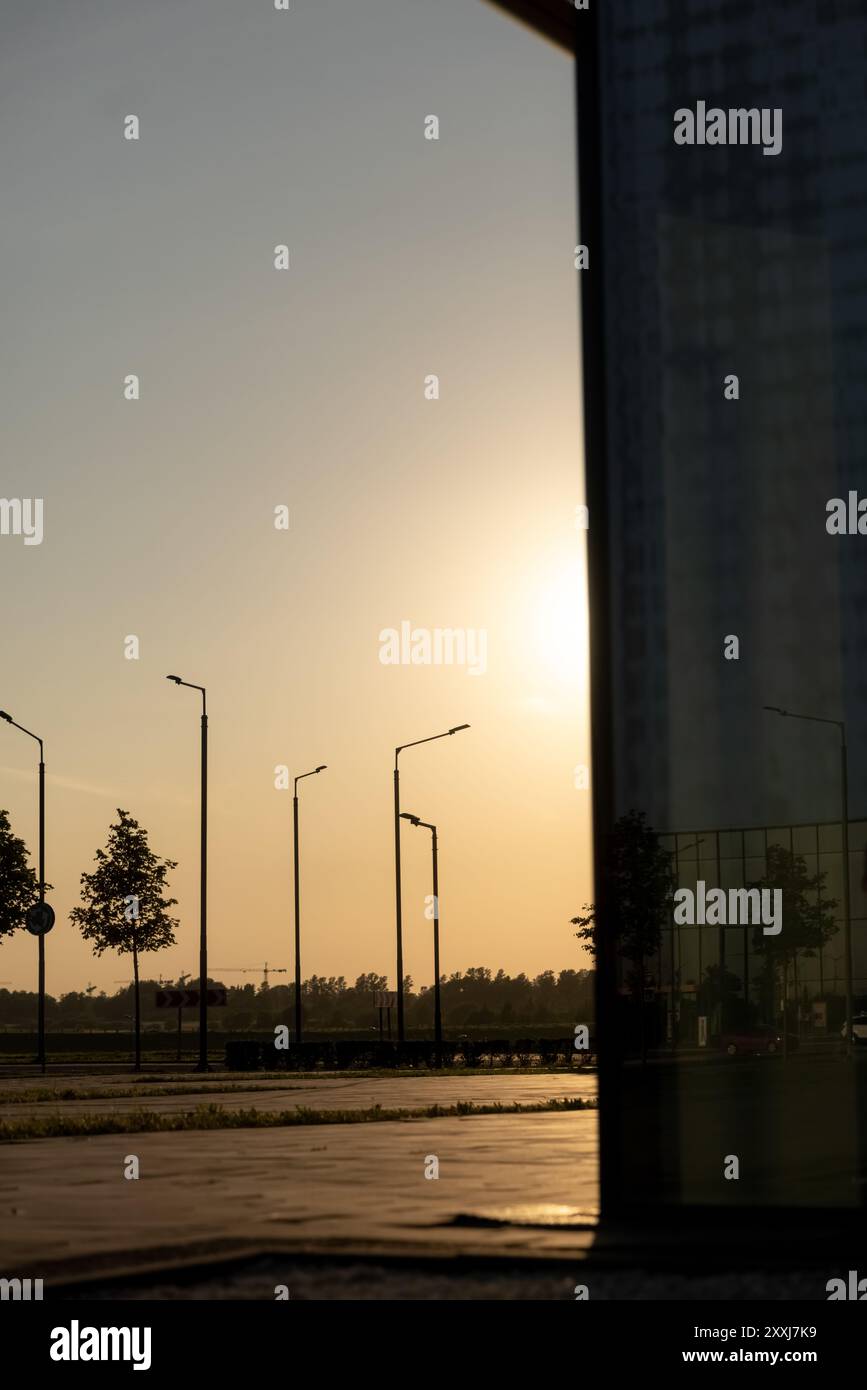 sunset sky with buildings and street light Stock Photo - Alamy