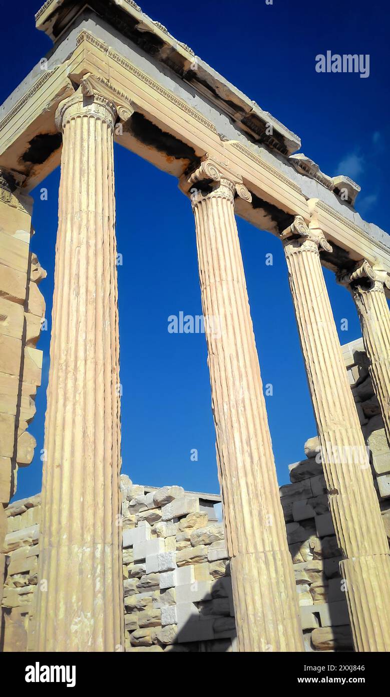 Columns of the Ionic order against a blue sky in vertical format Stock ...