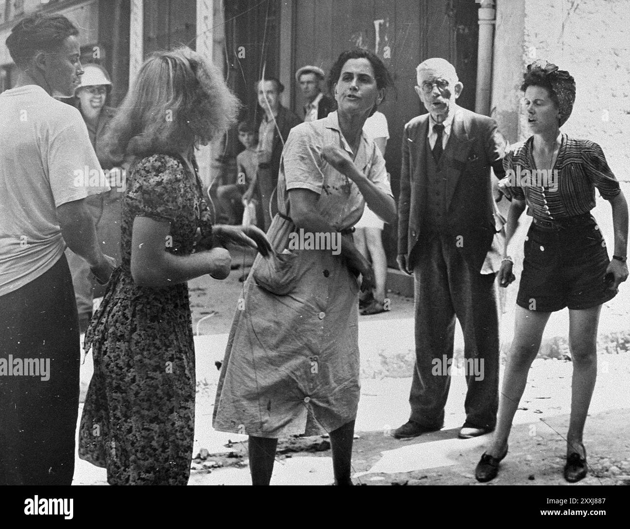 Angry people in Brignoles in France publicly remonstrate with a woman ...