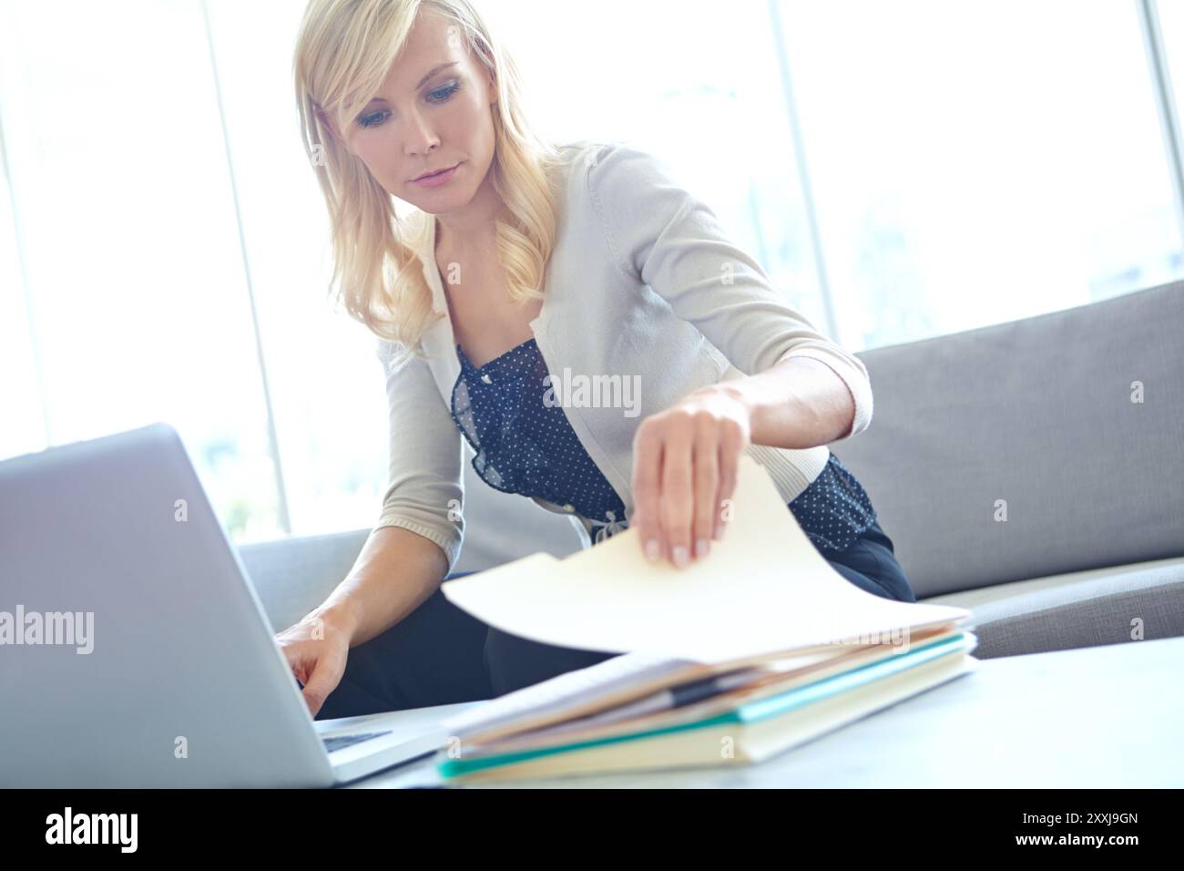 Business, paperwork and woman with laptop, typing and connection with ...