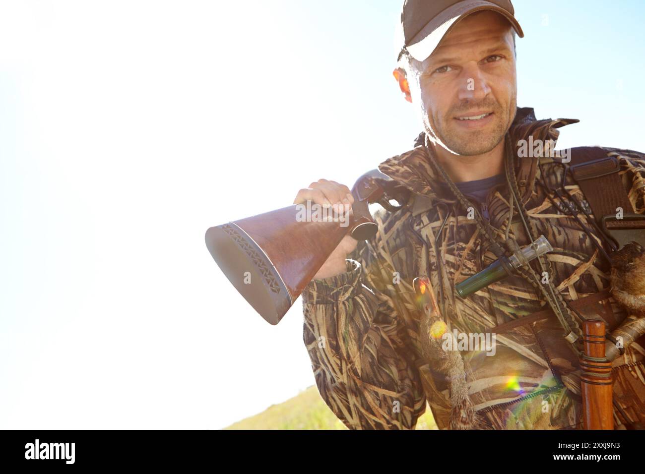 Man, hunter and rifle in portrait for sport, activity and trophy as ...