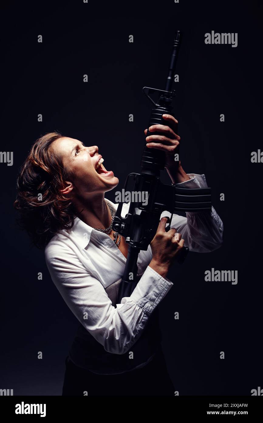 Woman, rifle and professional assassin in studio, angry corporate ...
