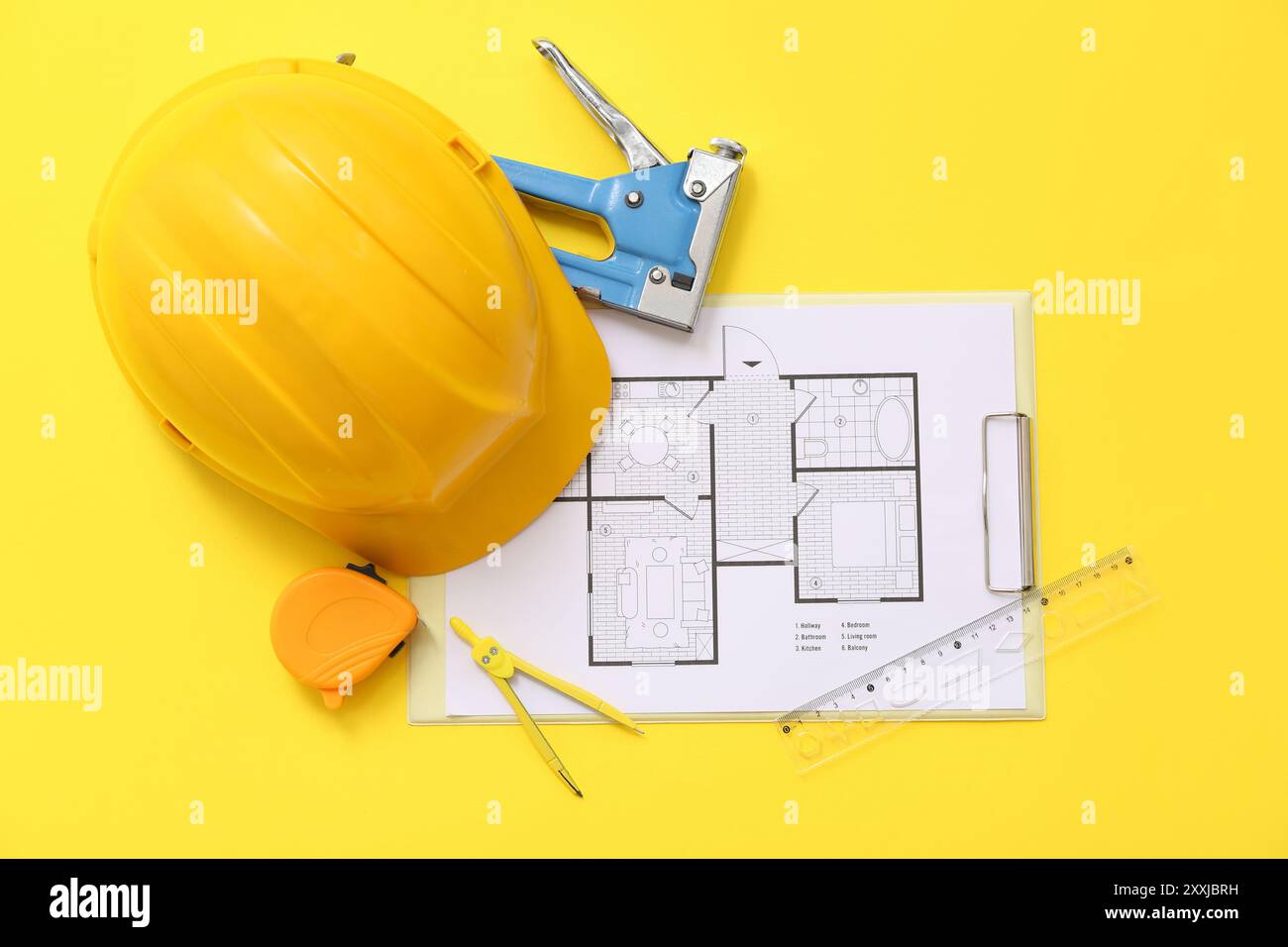 Architect's supplies with house plan on yellow background Stock Photo ...
