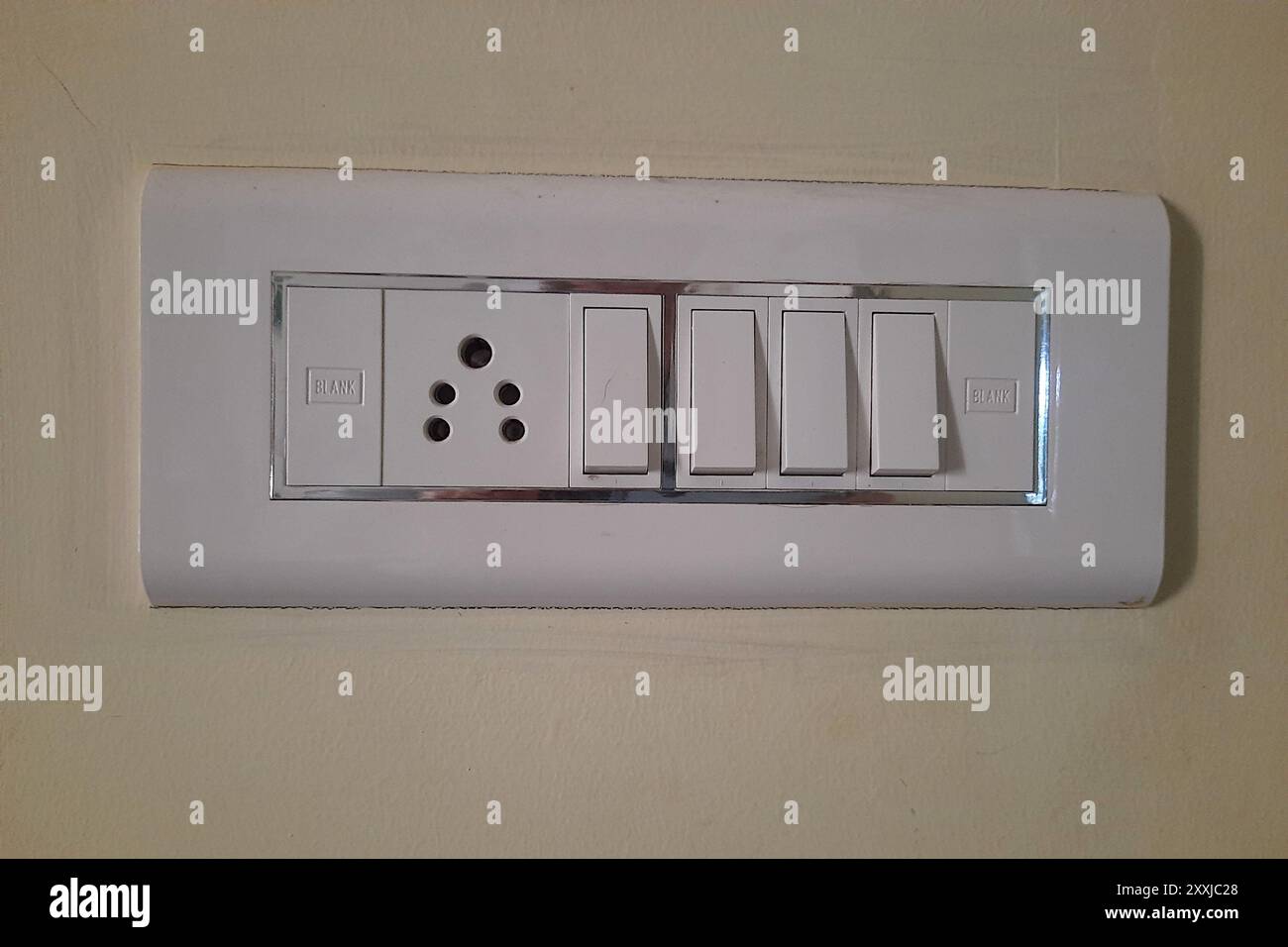 View of modular, modern, white, electrical panel with plug sockets and ...