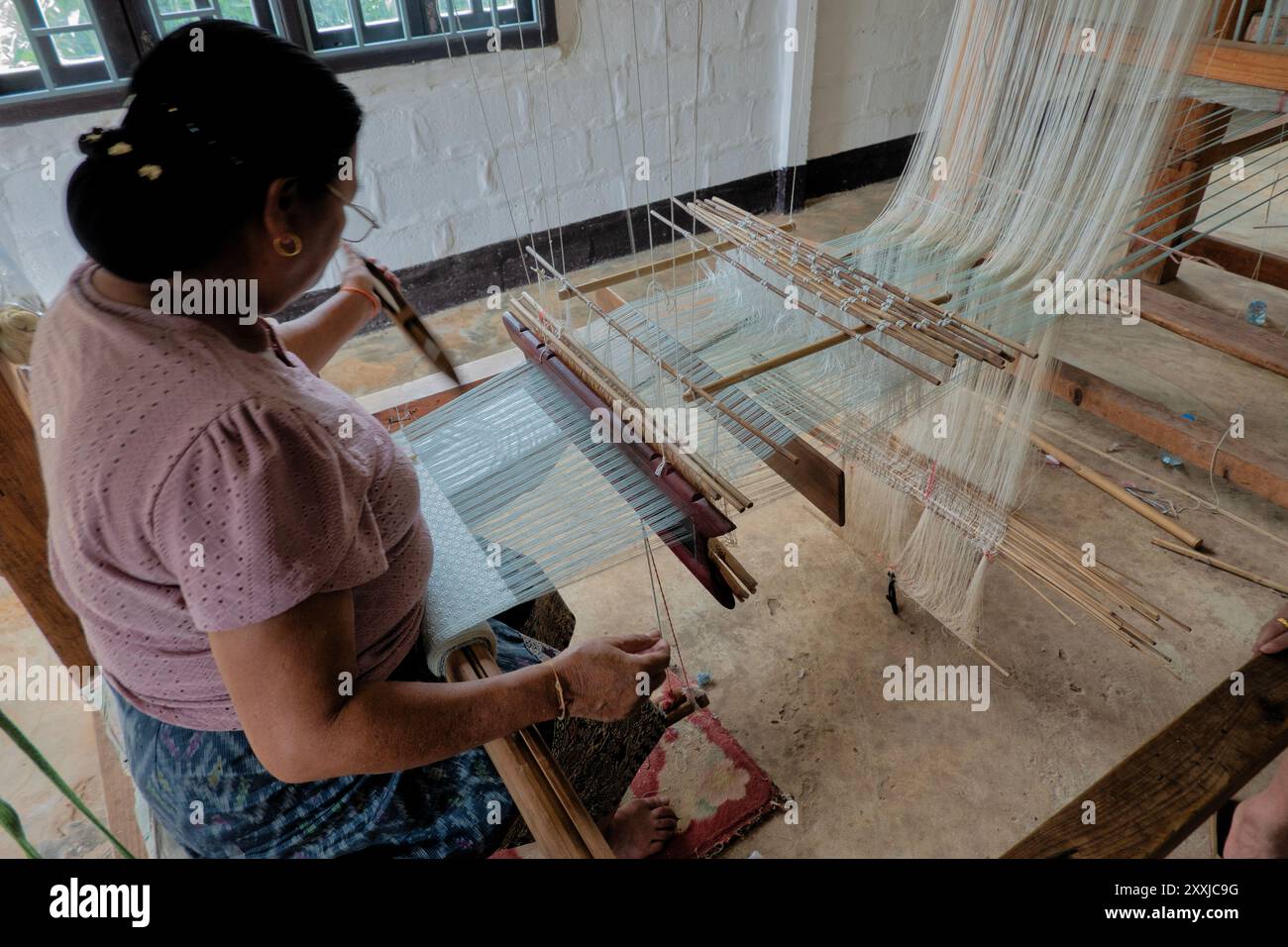 Backstrap weaving at the Mulberry Organic Farm sericulture project, Phonsavan, Xieng Khouang ...
