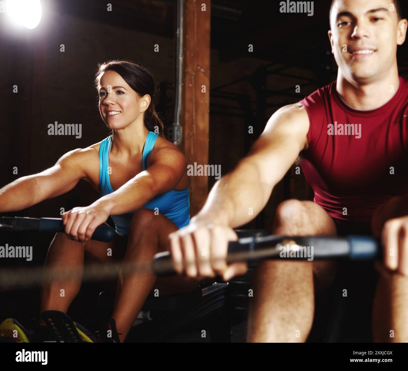 People, fitness and rowing machine at gym for core workout, abs ...