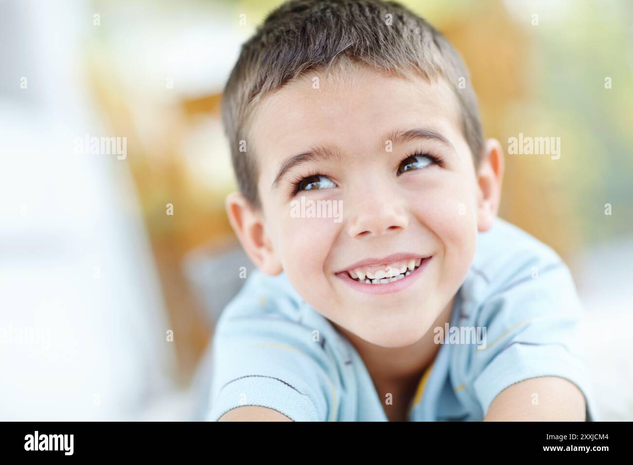 Home, relax and child with smile on carpet for weekend enjoyment, break ...
