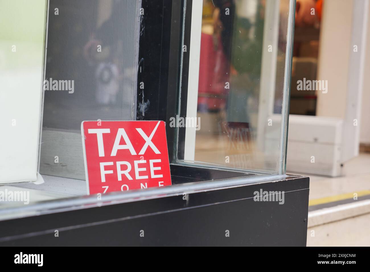 Prominent TaxFree Zone Sign Displayed in the Retail Store Window for ...