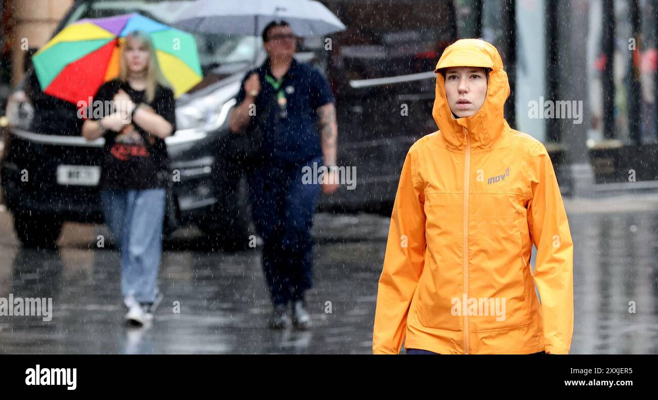 London, UK. 25th Aug, 2024. People walk in rain in London, Britain, Aug ...