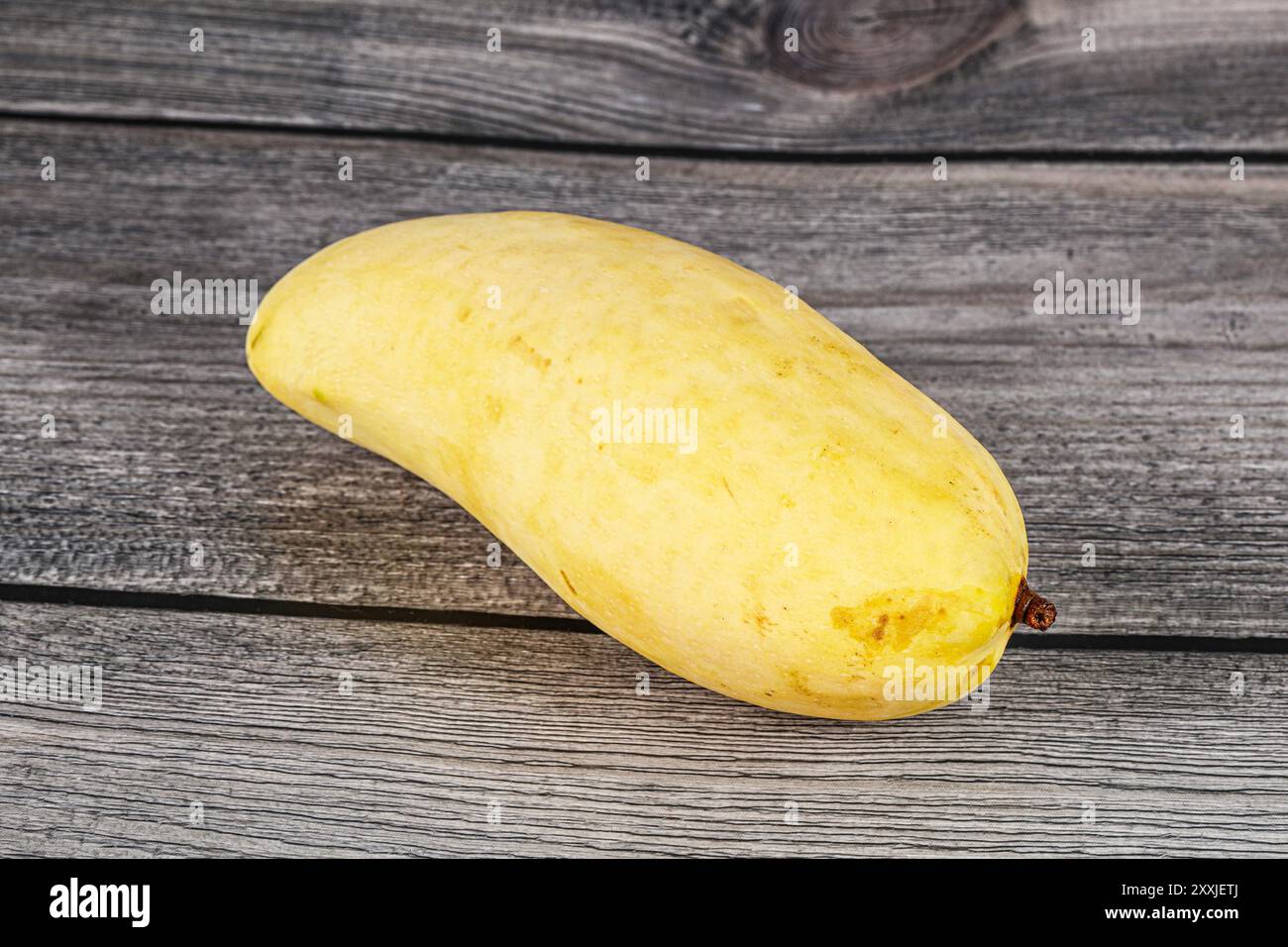 Tropical exotic fruit - ripe yellow mango Stock Photo - Alamy