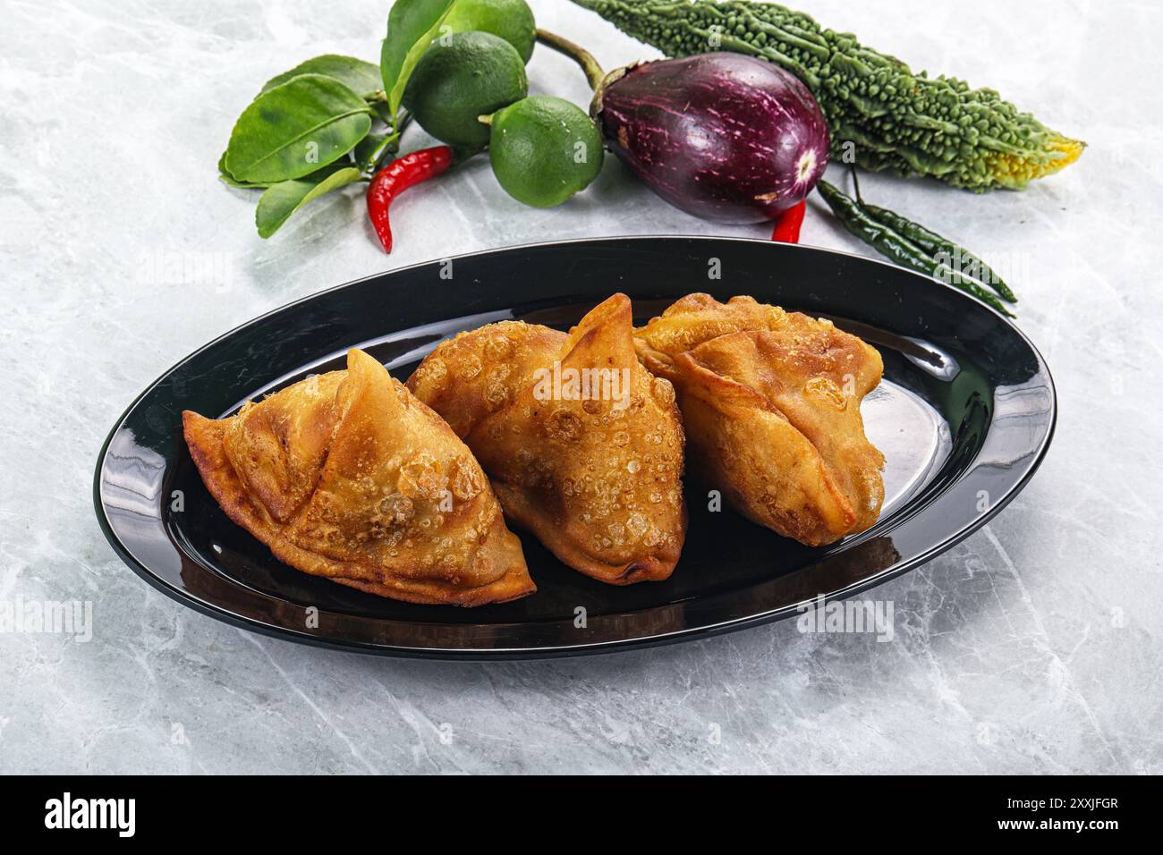 Indian cuisine - fries crispy stuffed samosa Stock Photo - Alamy