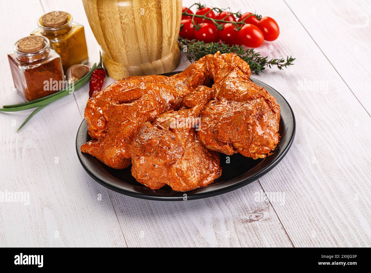 Raw turkey shoulder wing in Indian tandoori marinade spices Stock Photo ...
